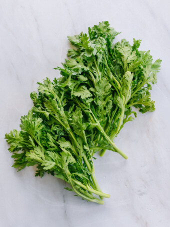 Stir-Fried Tong ho (Chrysanthemum Greens - 炒茼蒿) - The Woks of Life